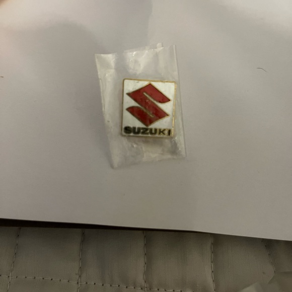 Jewelry | Suzuki Red And Gold Logo Pin | Poshmark